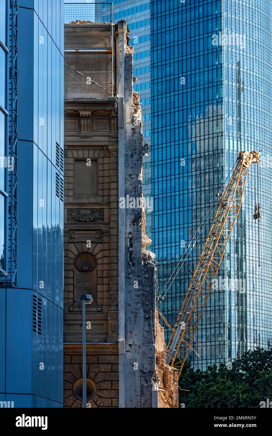 Construction site, crane demolishing historic apartment building ...