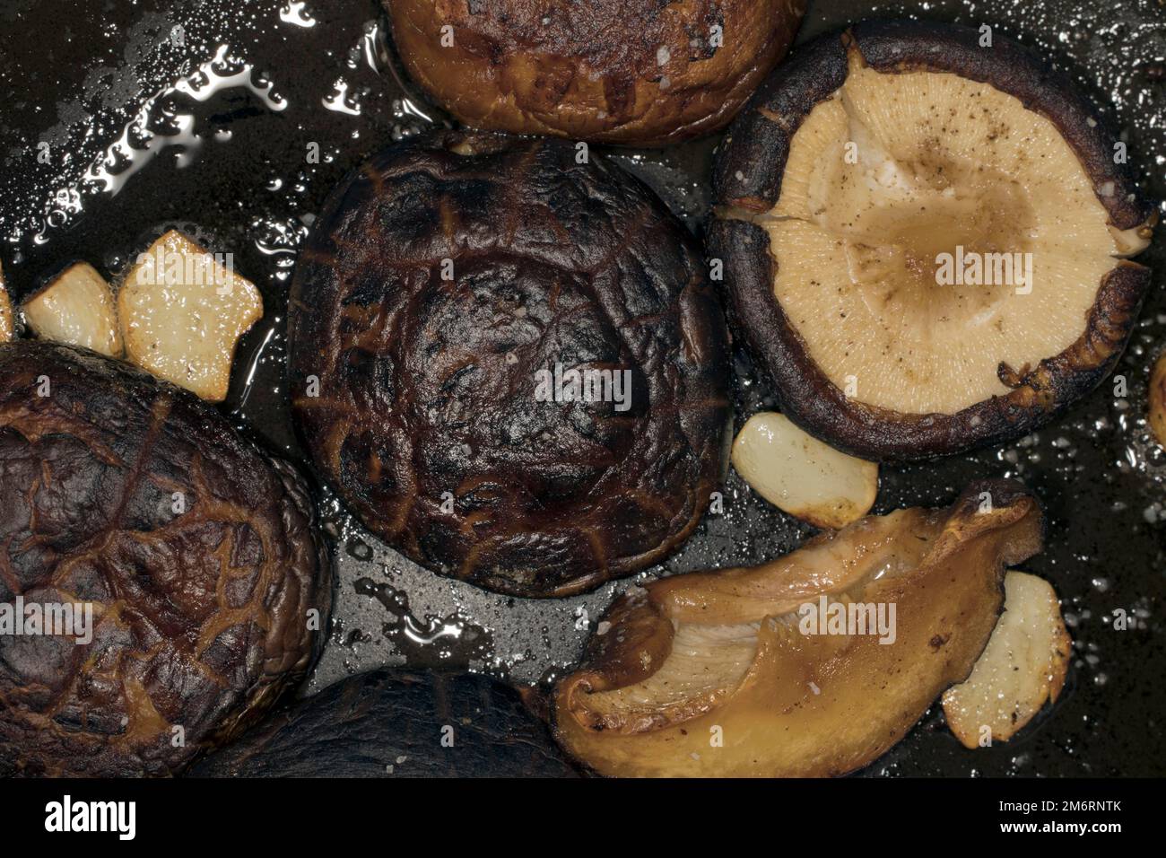 Fried shiitake mushrooms, food photography with black background Stock ...