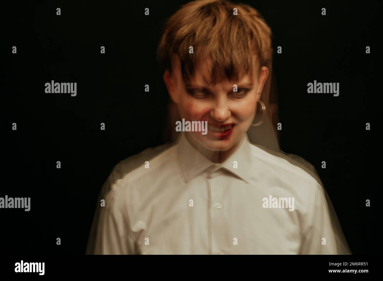 crazy psychopathic girl with mental disorders in a straitjacket on a ...