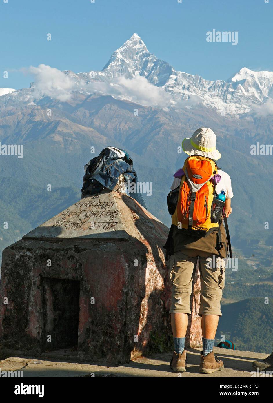 A Nepalese hiker looks at the Annapurna mountain range in the Himalayas ...
