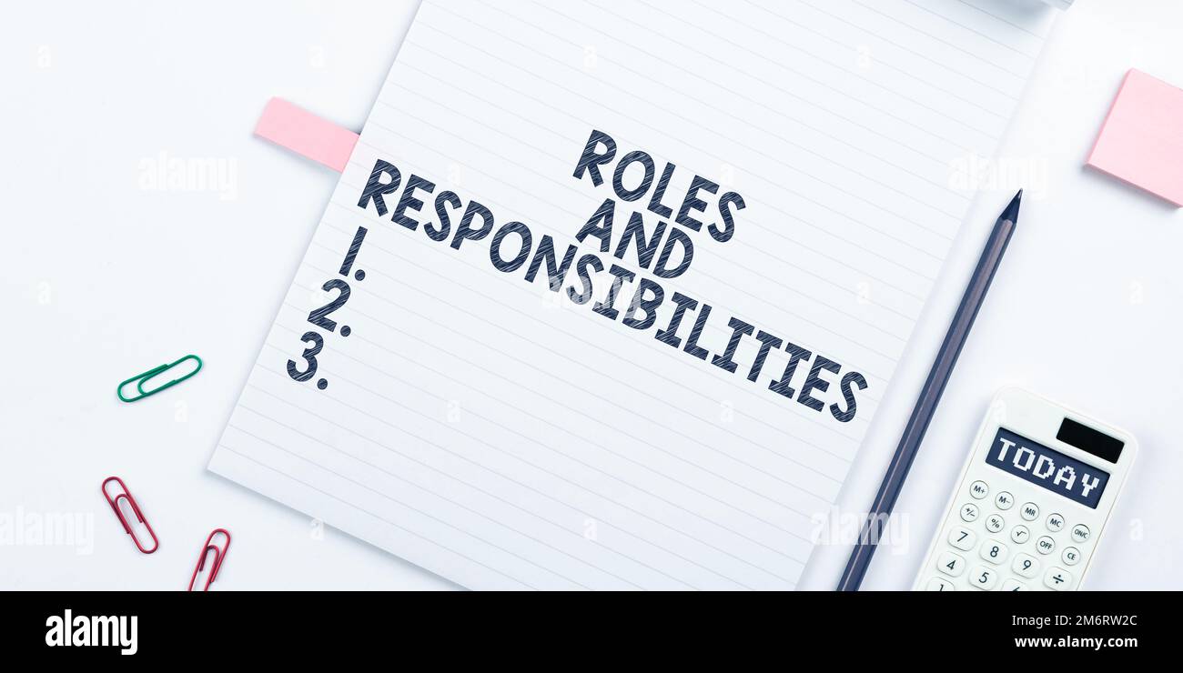 Hand writing sign Roles And Responsibilities. Business showcase ...