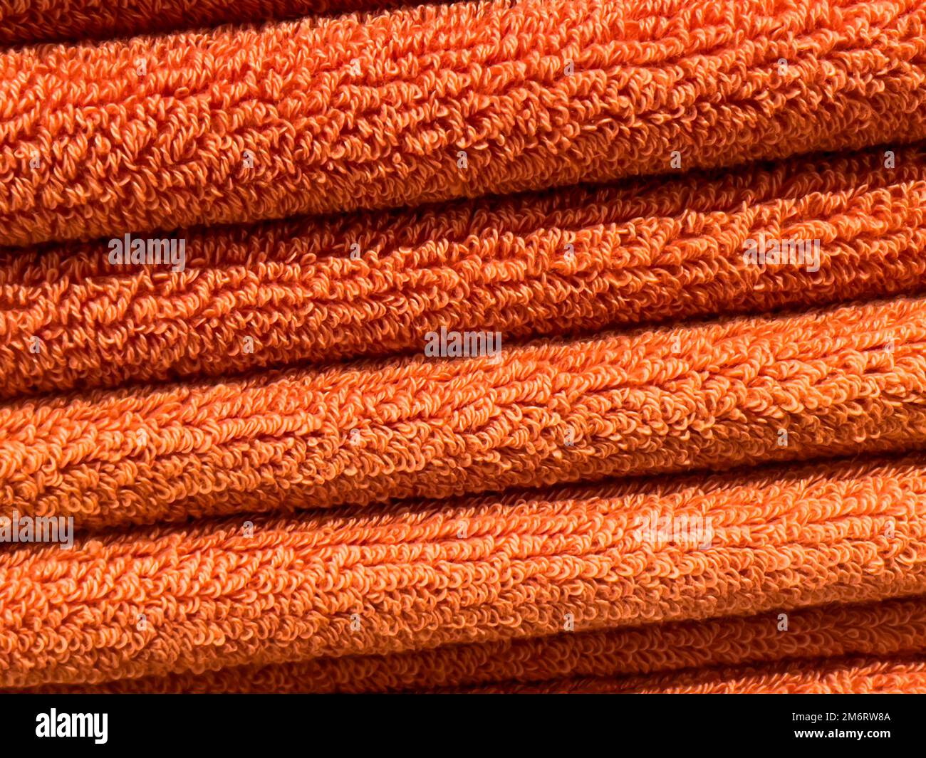 Fabric background. Folded fabric on a shelf. Close-up Stock Photo - Alamy