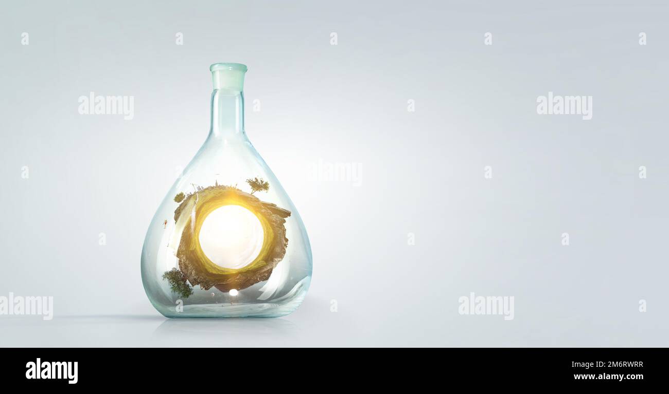 Green sphere landscape inside glass bottle Stock Photo - Alamy
