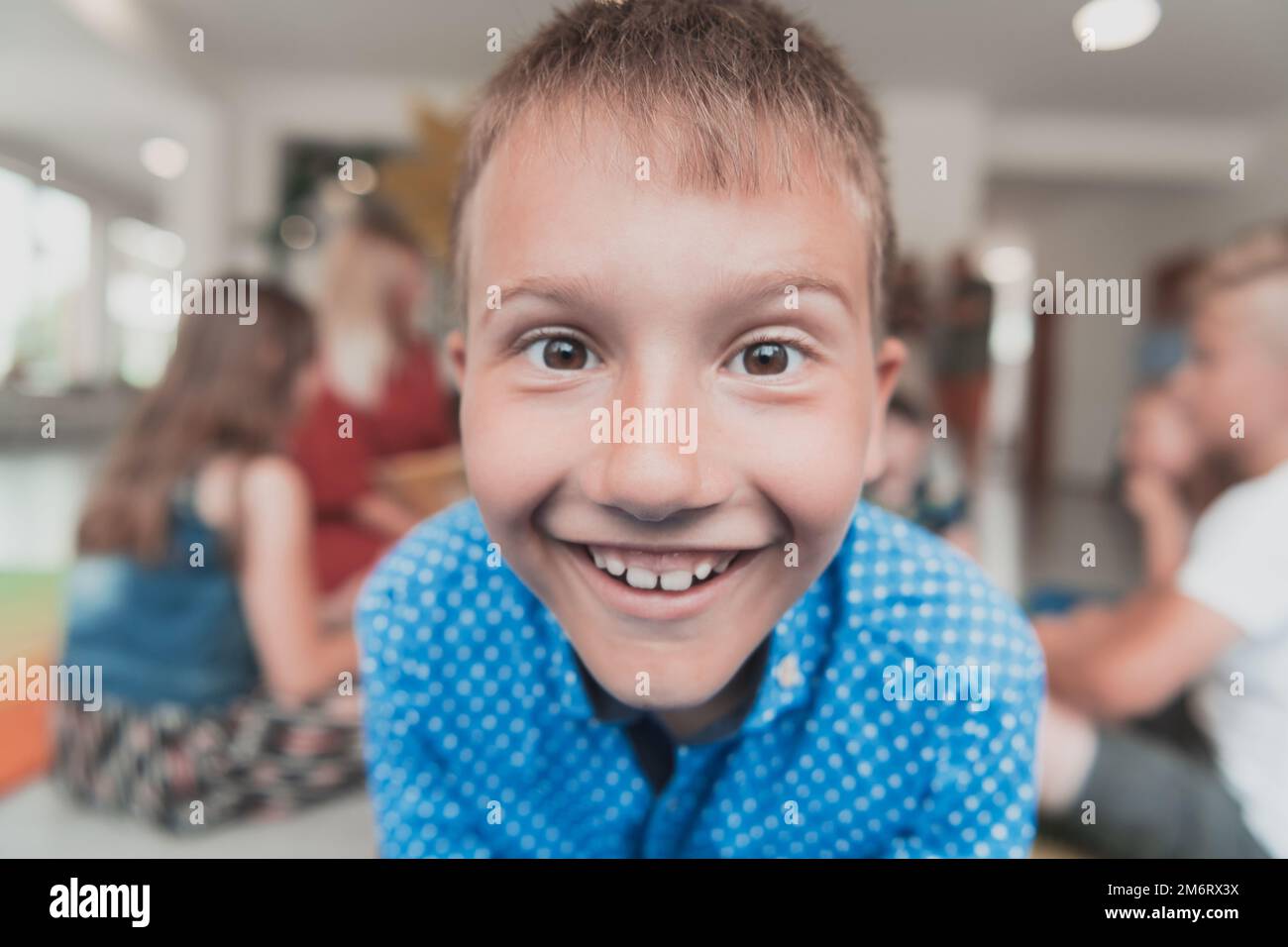 Portrait photo of a smiling boy in a preschool institution having fun ...