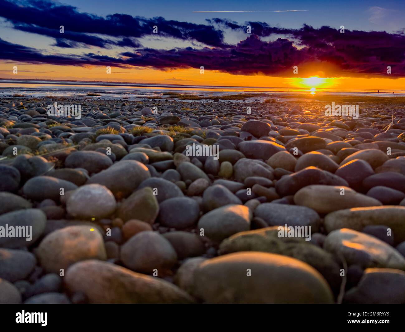 Pebbled Beach Sunset Stock Photo - Alamy