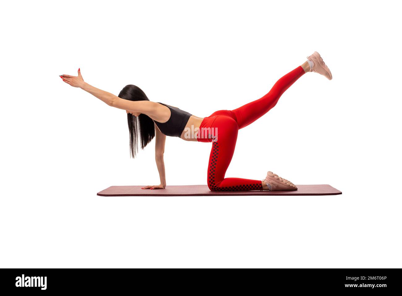 Slim woman doing yoga on mat Stock Photo - Alamy