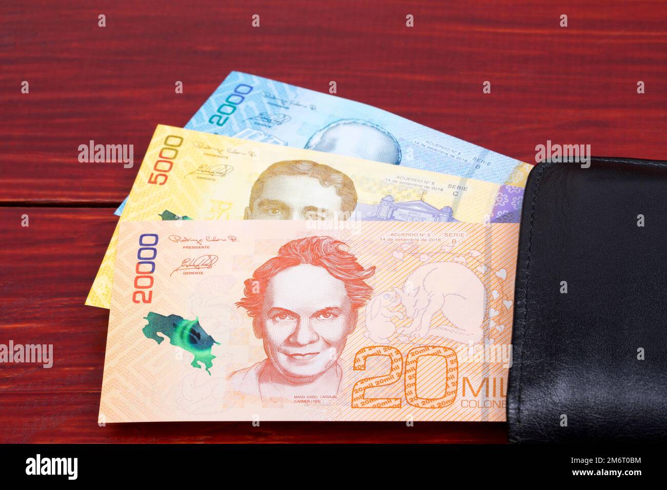 Costa Rican colon in the black wallet Stock Photo - Alamy