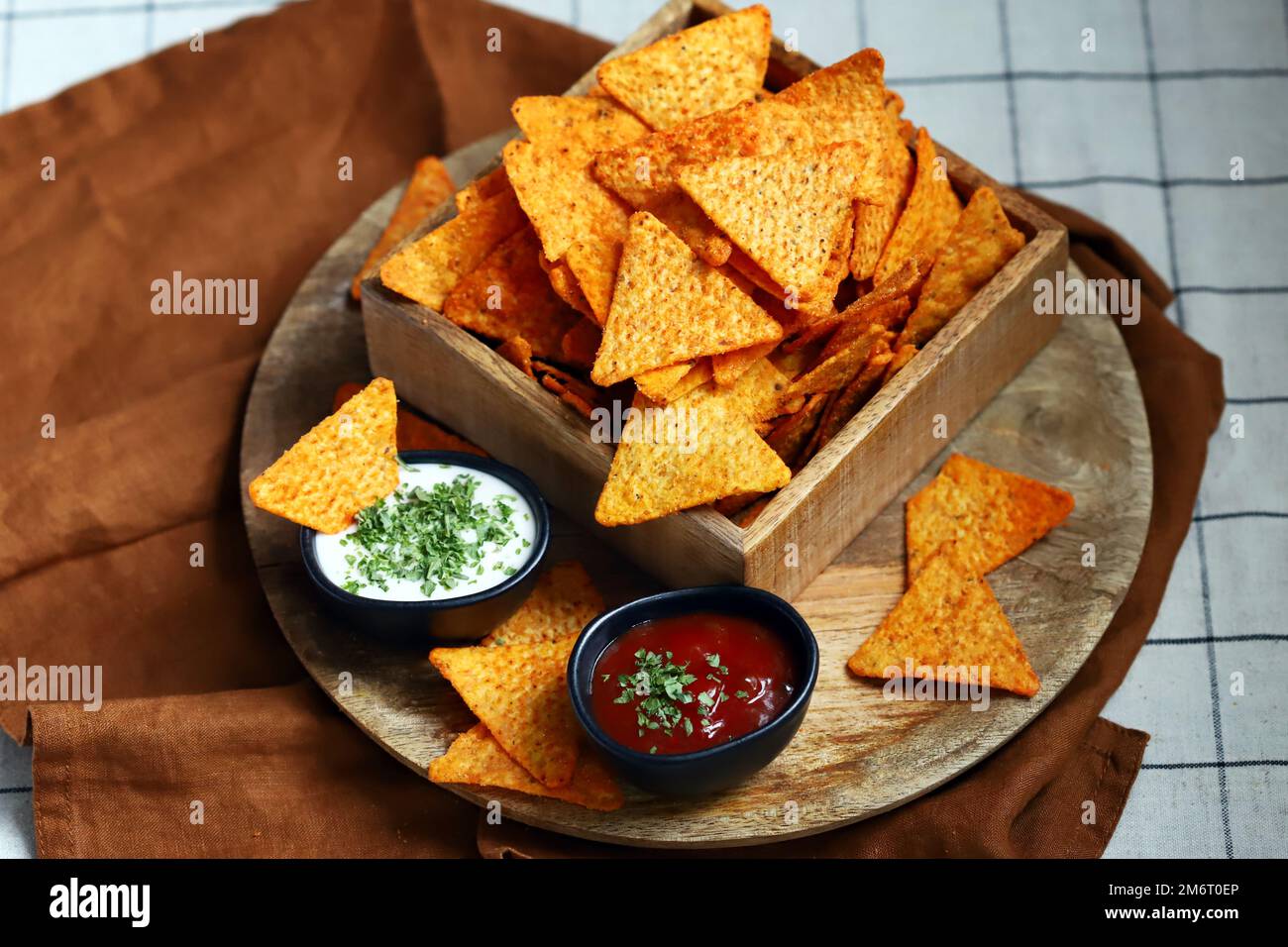 Chips nachos with sauces. Mexican snacks Stock Photo - Alamy
