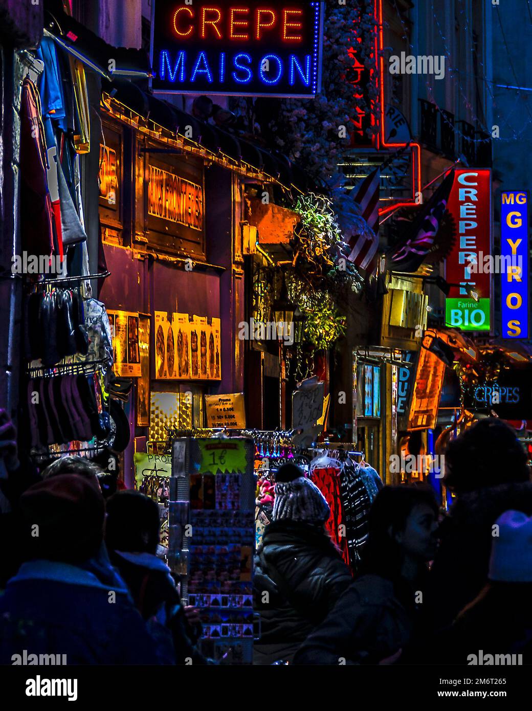 Paris crowded street night scene Stock Photo - Alamy
