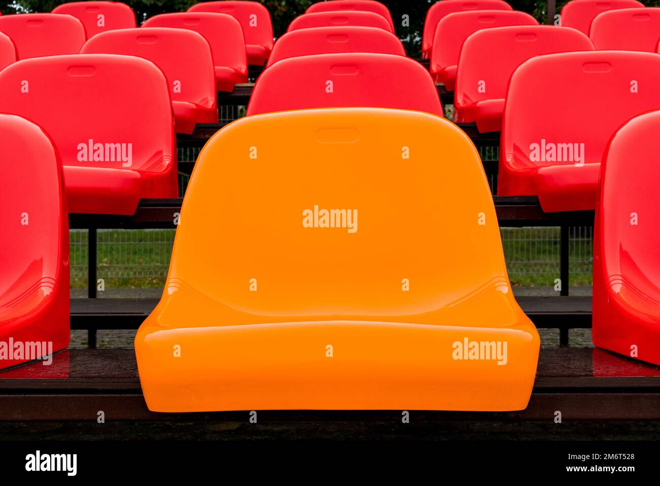 One yellow seat and rows of red ones, as indviduality concept Stock ...