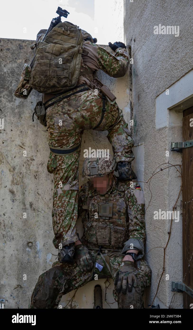 German Special Forces snipers use each other as leverage to get over a ...