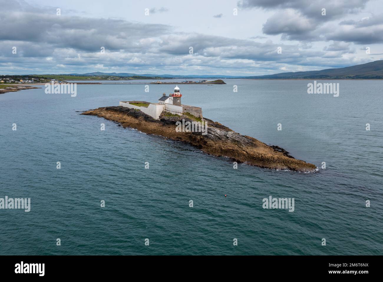 View of the historic Fenit Lighthouse on Little Samphire Island in ...