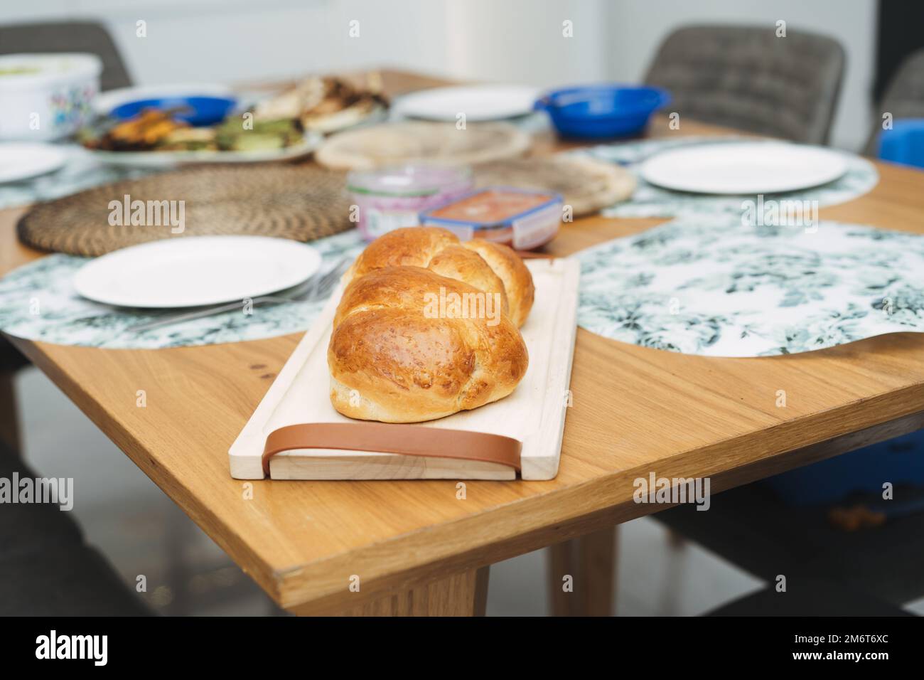 Challah bread on a table for Shabbat meal. Brioche. Homemade soft ...