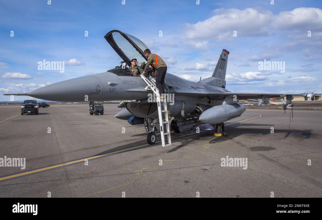 Capt. Connor Watson, 36th Fighter Squadron, pilot, laughs with Senior Airman Manuel Hernandez ...