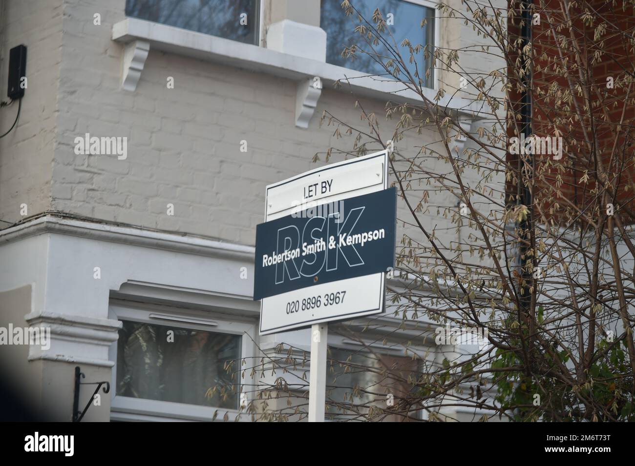 Estate Agent signs on residential houses Stock Photo - Alamy