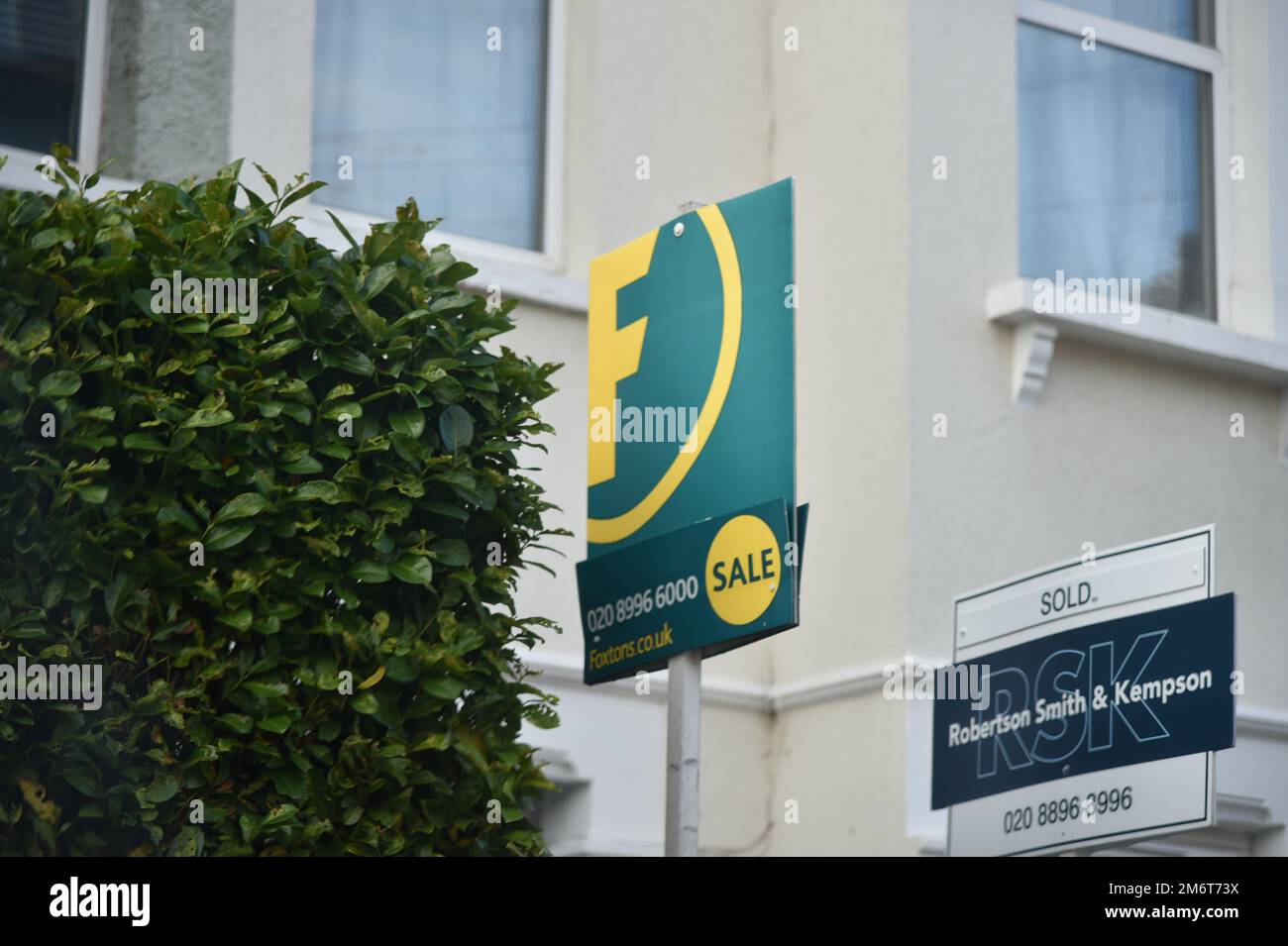 Estate Agent signs on residential houses Stock Photo - Alamy