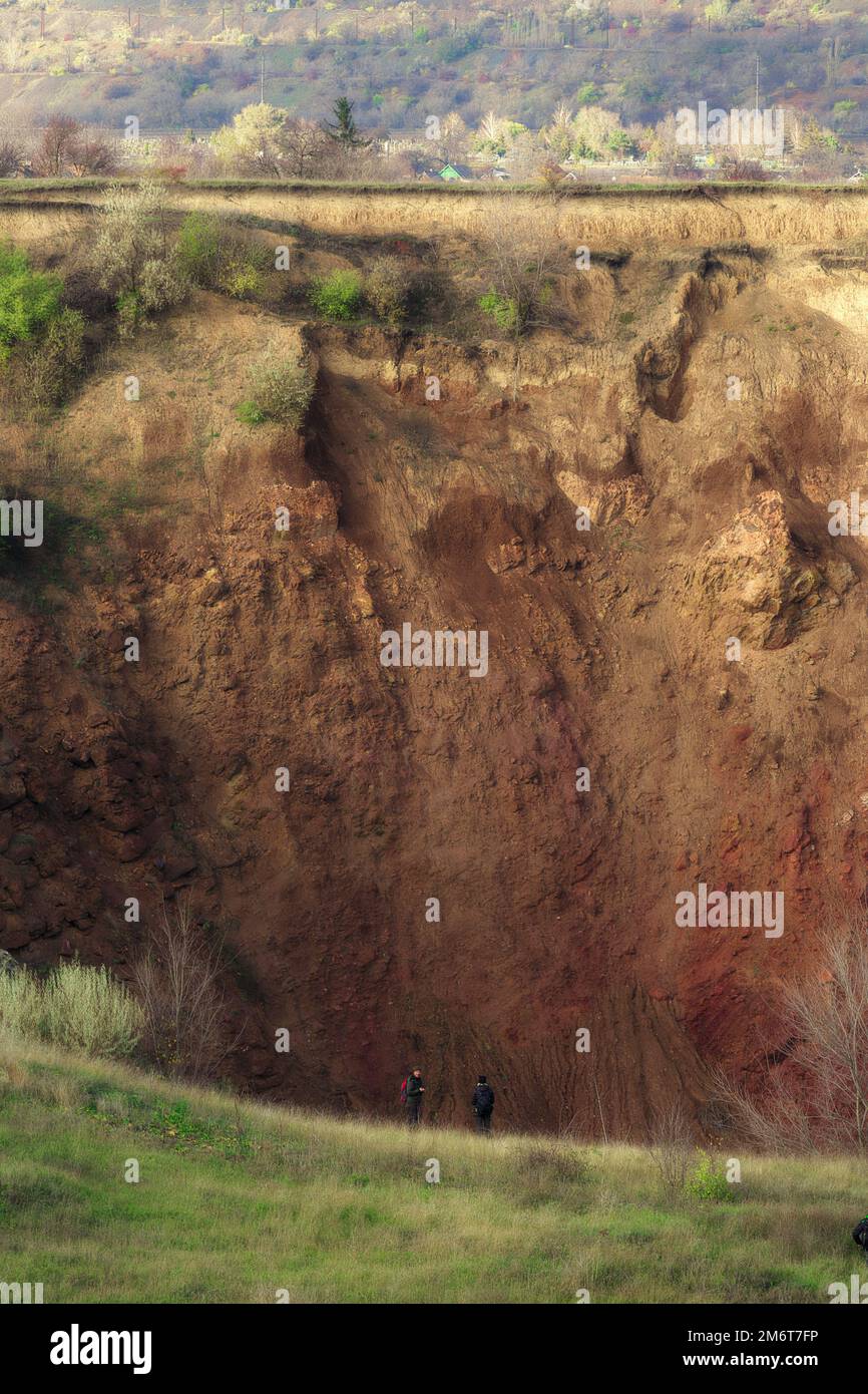The couple staying on a giant collapsed ground zone background ...