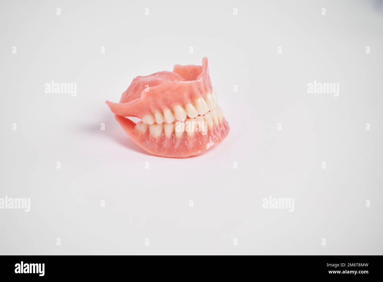 Dental prostheses on a white background. Beautiful teeth ceramic press ...