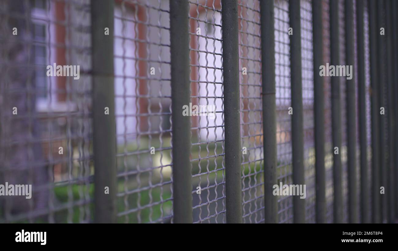 Metal gate grid in line patterns. Security gate Stock Photo - Alamy