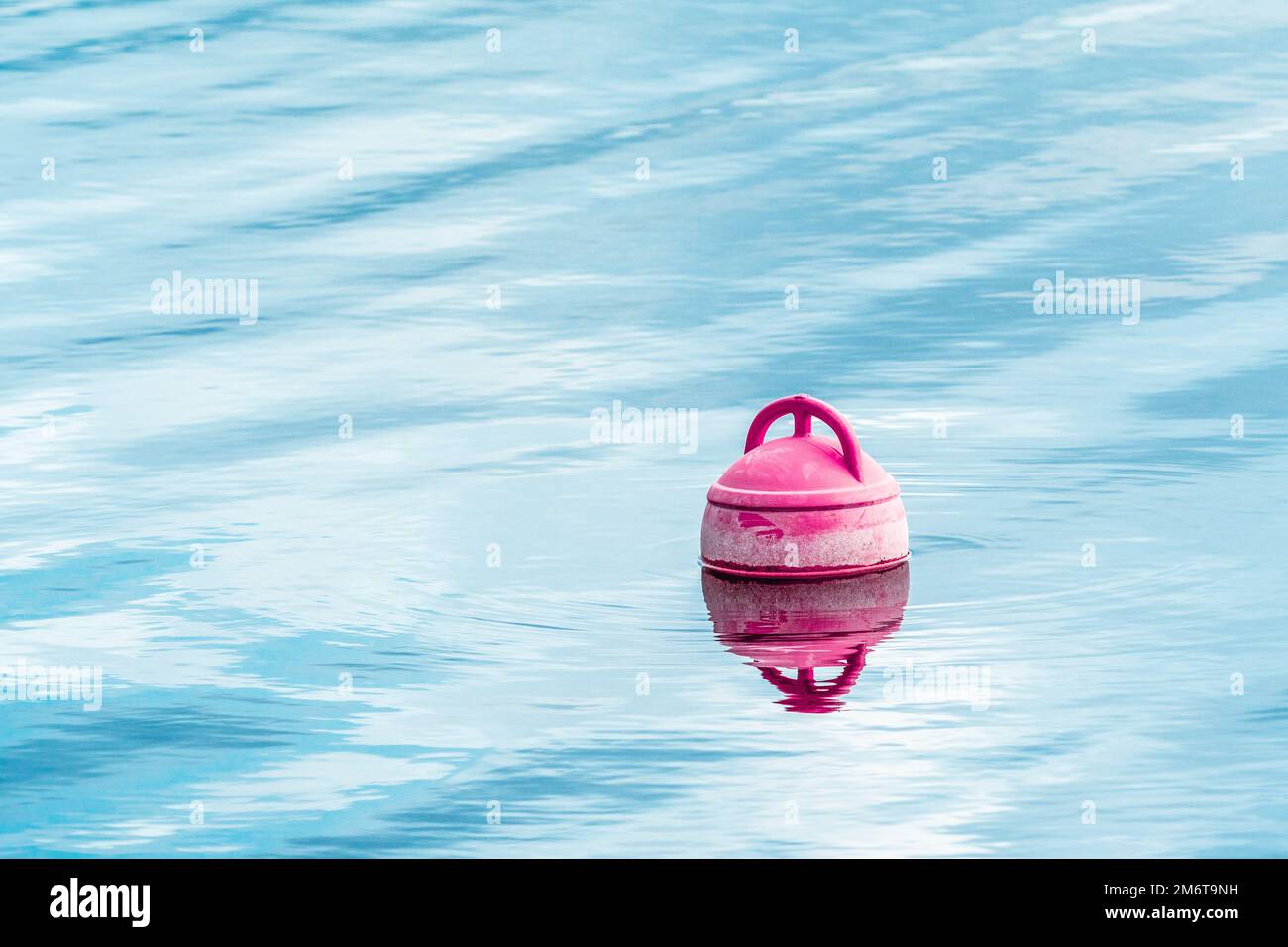 A pink beacon buoy in the sea Stock Photo - Alamy