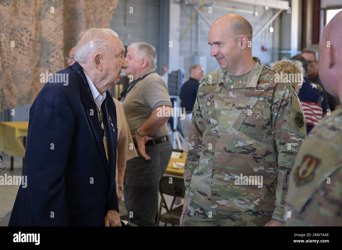 Retired Col. Charles Hartman speaks with Col. Ryan Keeney, the 49th ...