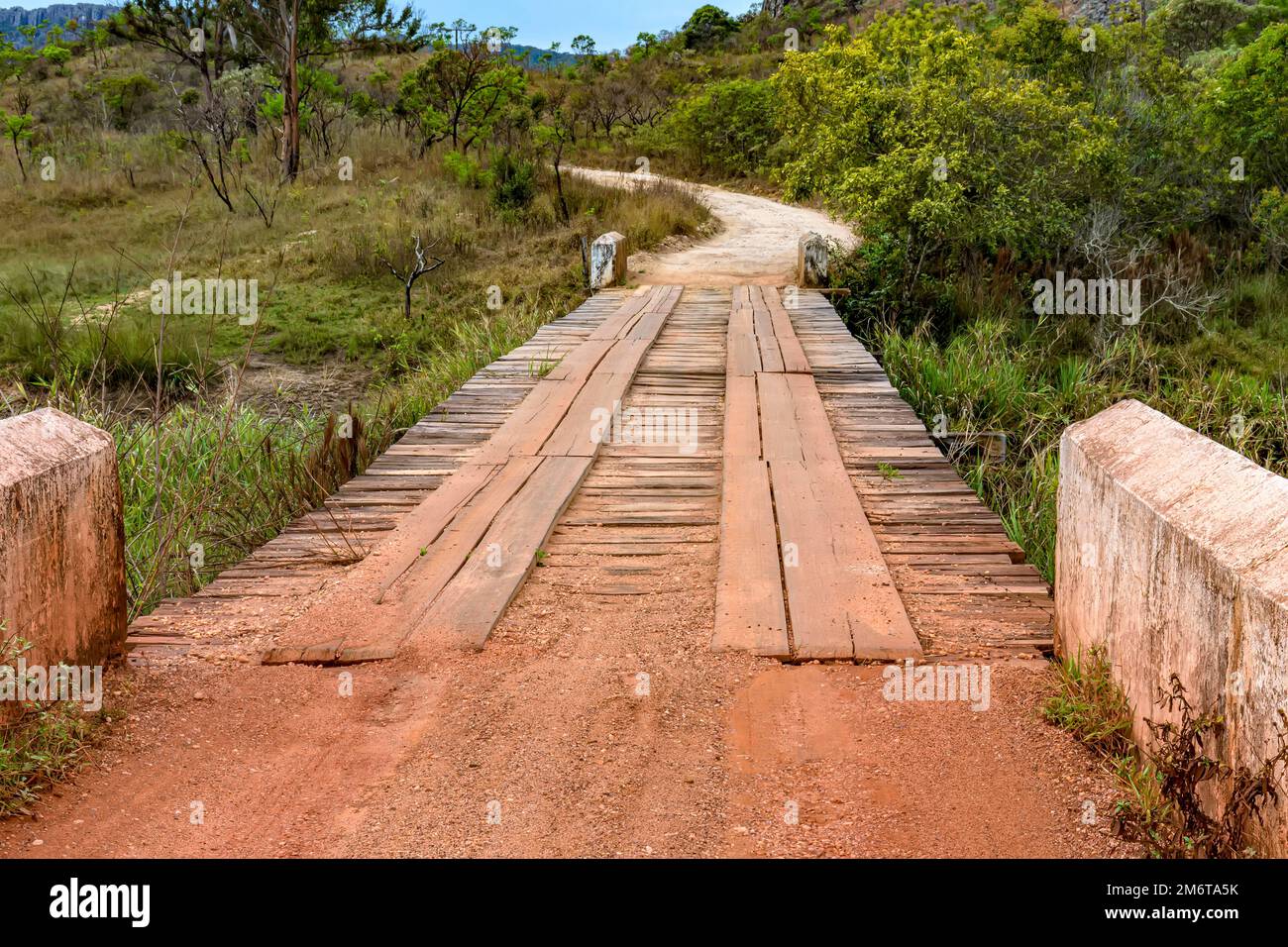 Dirt road with rustic and primitive wooden bridge in Diamantina Stock ...