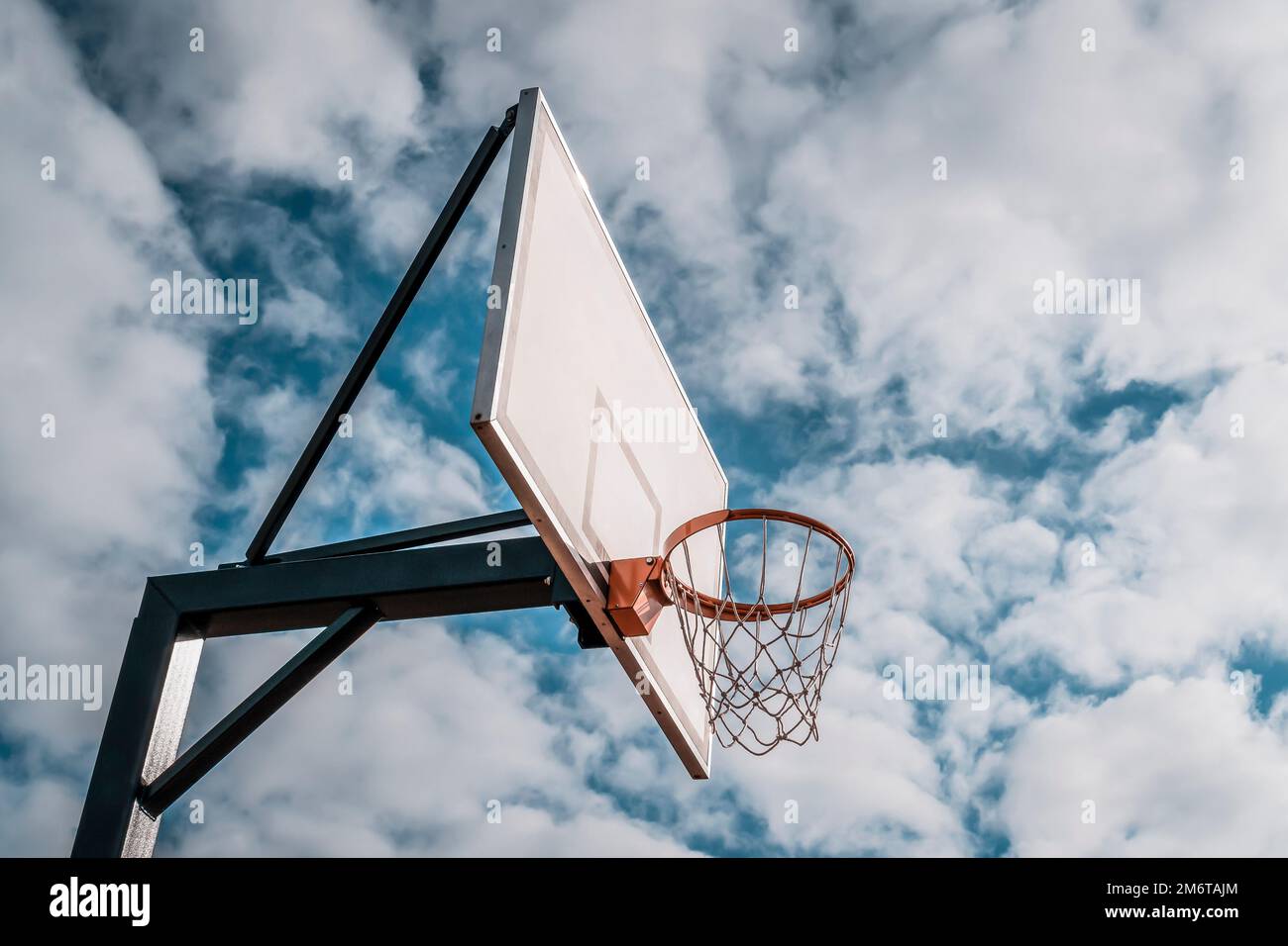 Basketball Backboard and Hoop in front of sky background Stock Photo ...