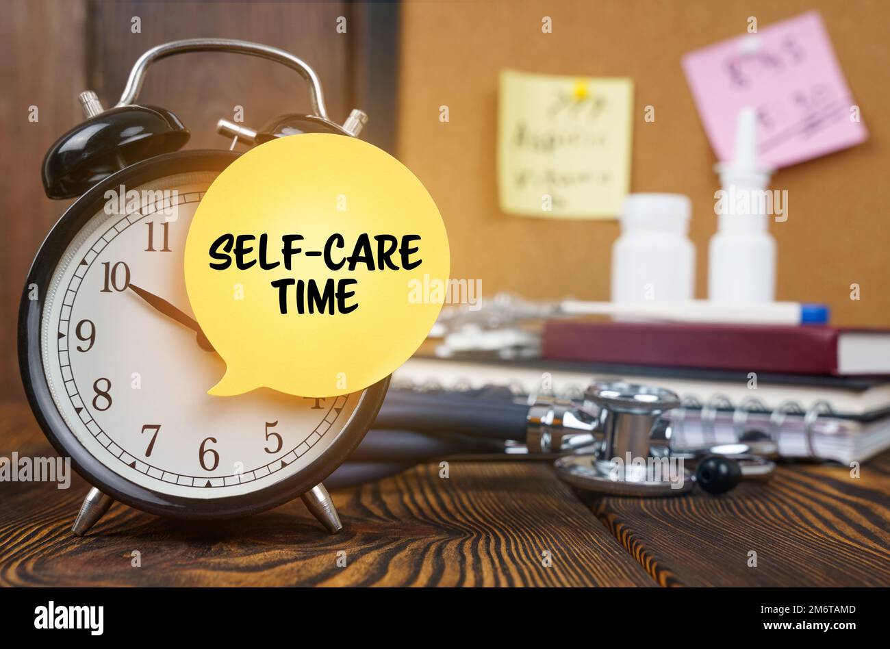 Medical concept. On the alarm clock a sticker with the inscription ...