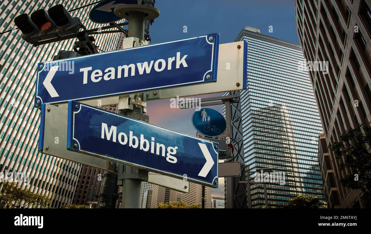 Street Sign to Teamwork versus Mobbing Stock Photo - Alamy