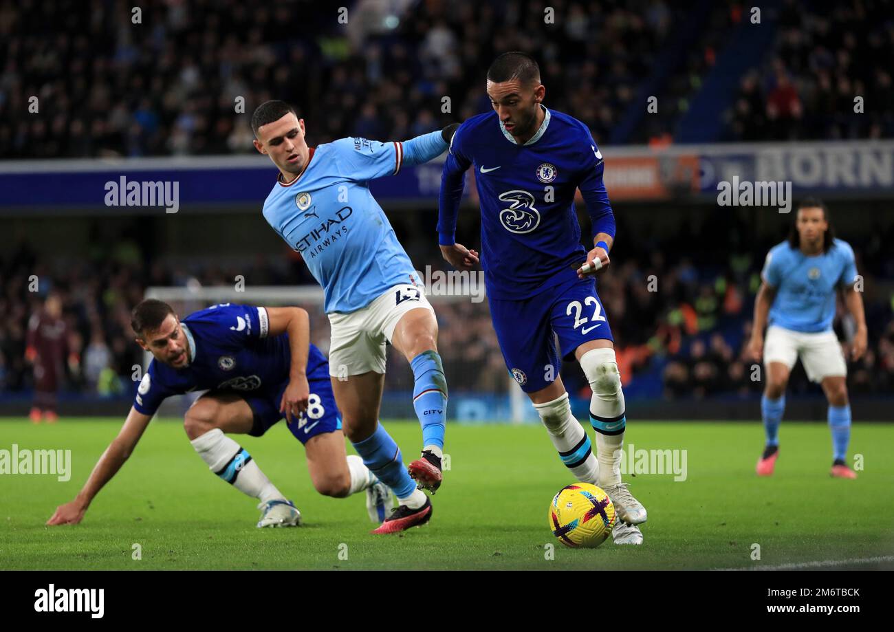 Manchester City's Phil Foden (centre) and Chelsea's Hakim Ziyech battle ...