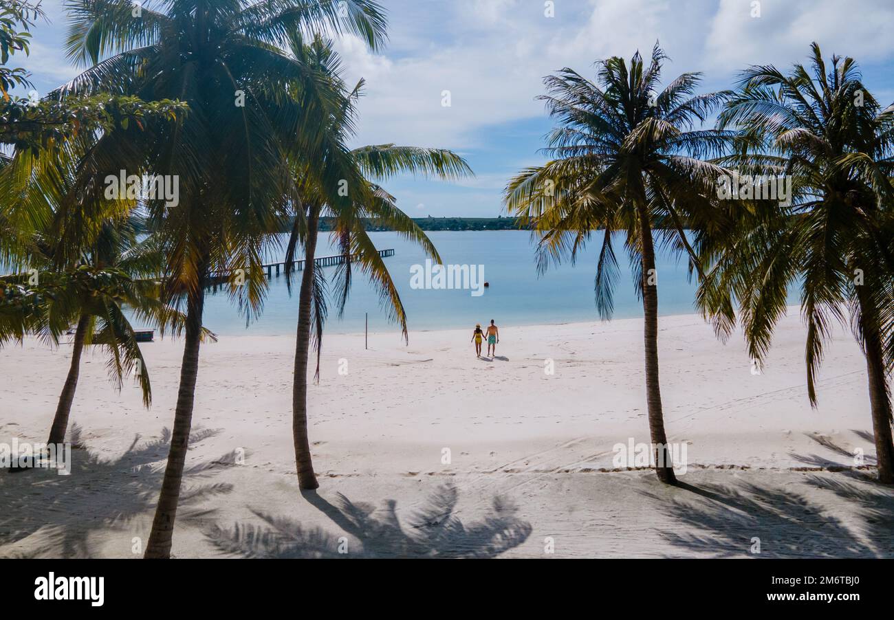 Drone aerial view couple men and women on a tropical beach in Thailand ...