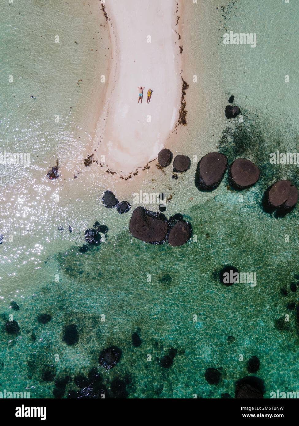 Drone aerial view couple men and women on a tropical beach in Thailand ...