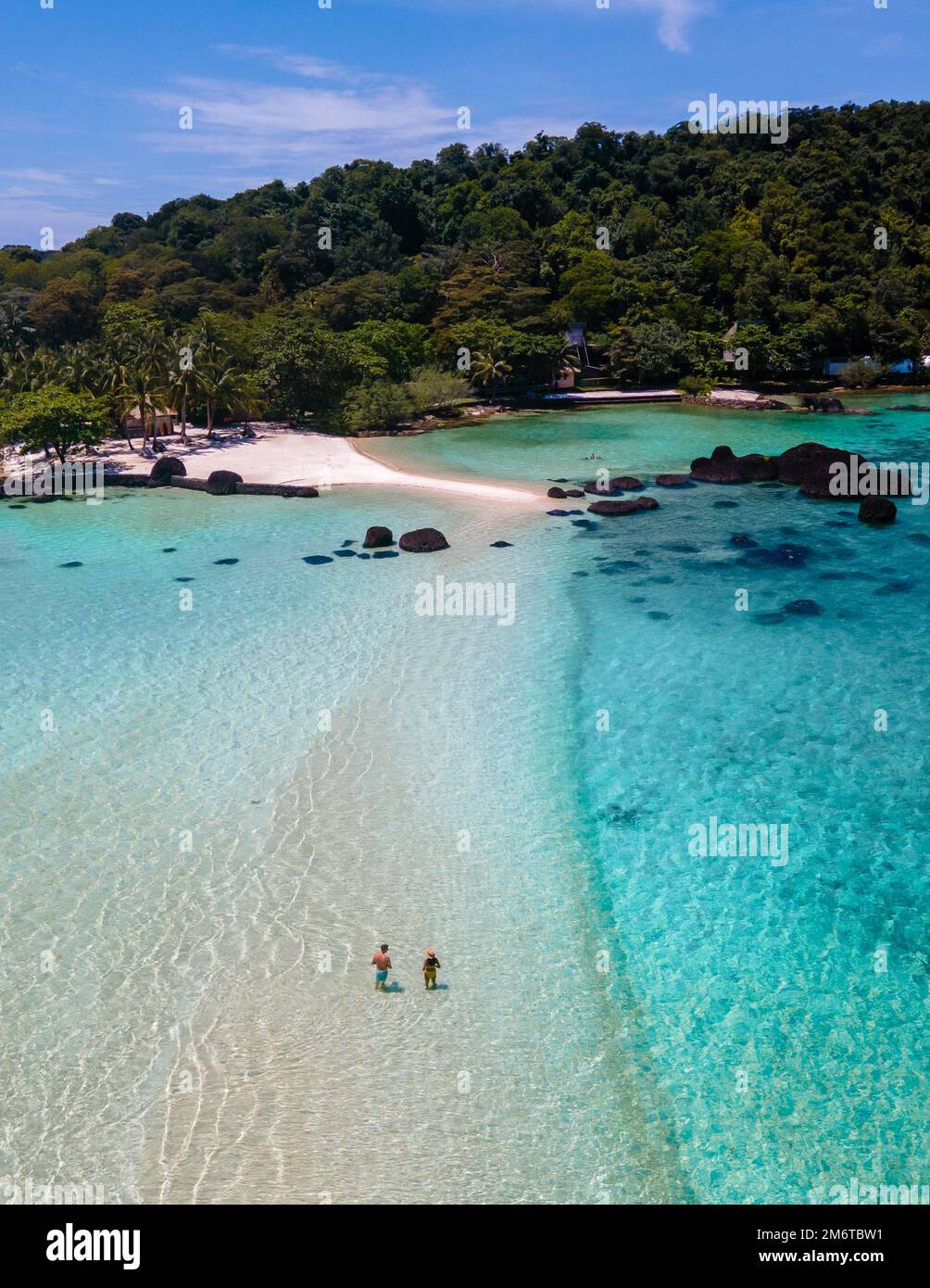 Drone aerial view couple men and women on a tropical beach in Thailand ...