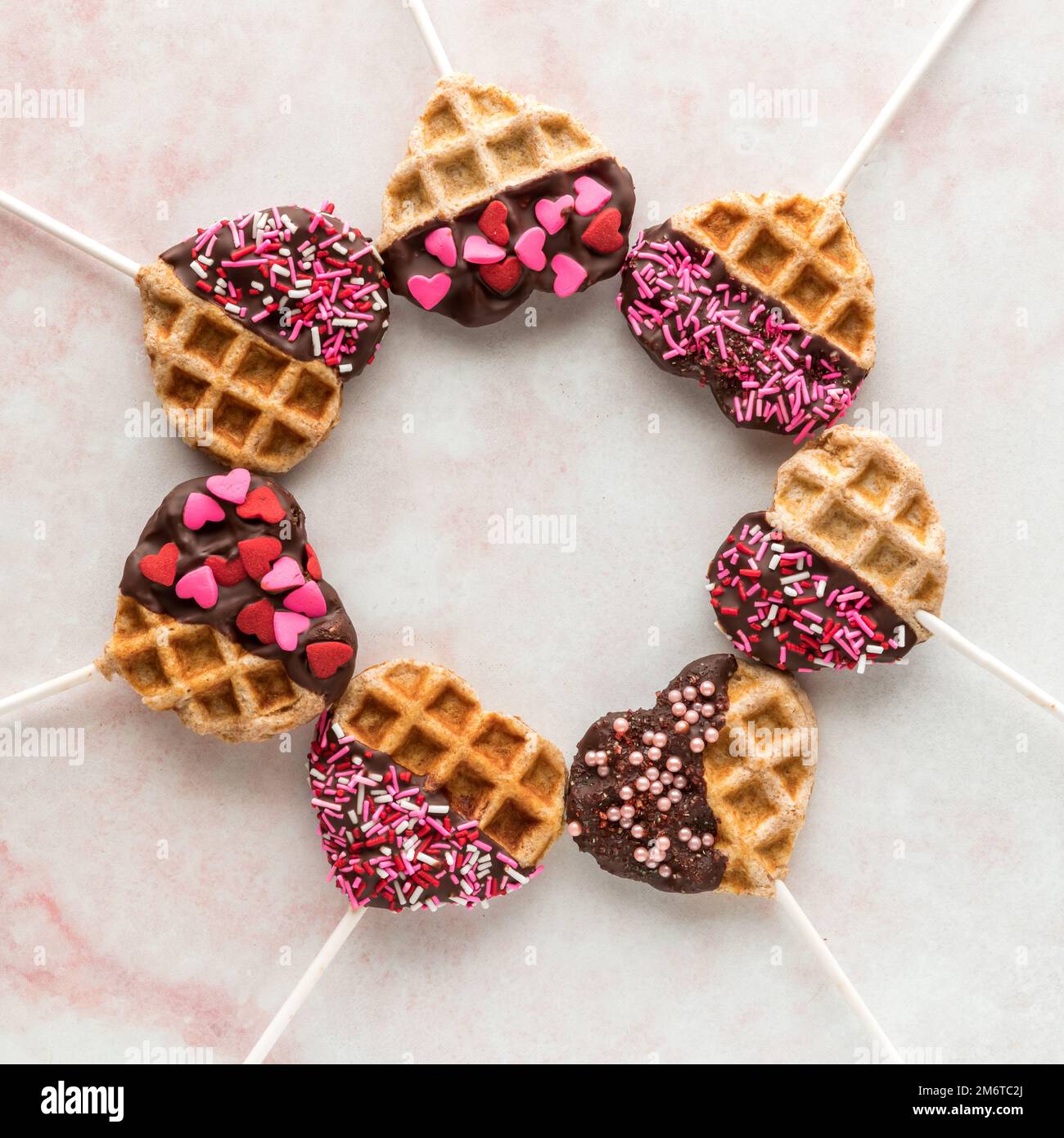 Heart shaped waffle pops for Valentine's Day in a circle. Square crop ...