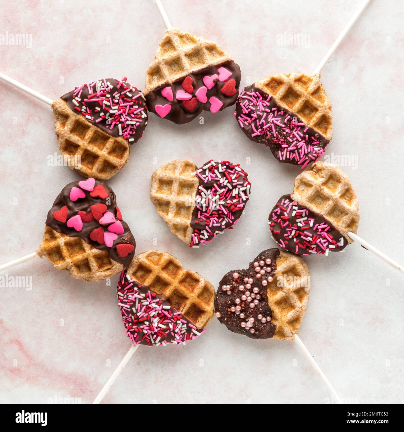Decorated mini waffle pops for Valentine's day displayed in a circle ...