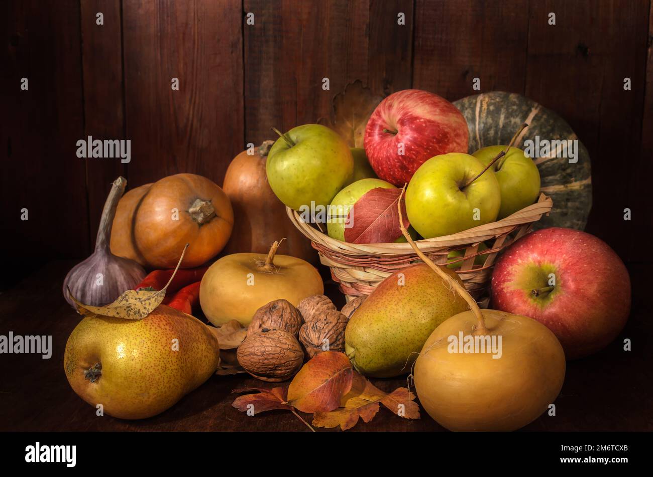 Fruits and vegetables on a dark wooden background in a rustic style ...