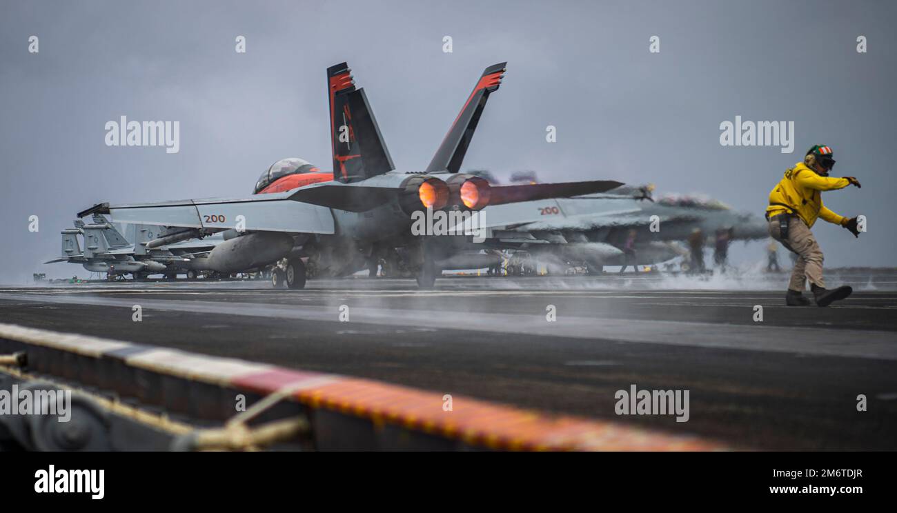 230105-N-MH015-1136 PHILIPPINE SEA (Jan. 5, 2023) An F/A-18E Super Hornet from the “Mighty ...