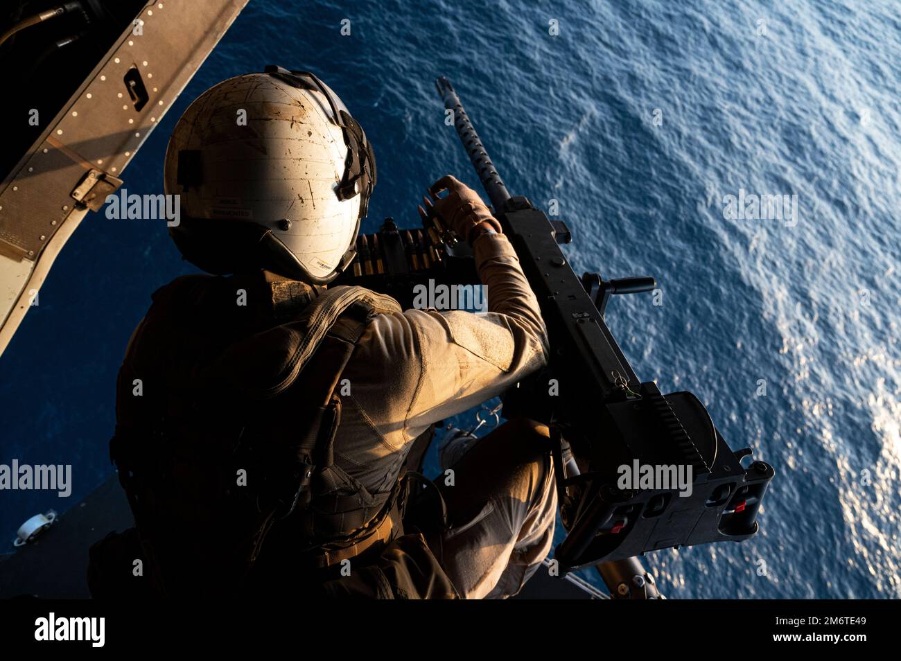 A U.S. Marine Corps MV-22 Osprey crew chief assigned to Marine Medium Tiltrotor Squadron 266 ...