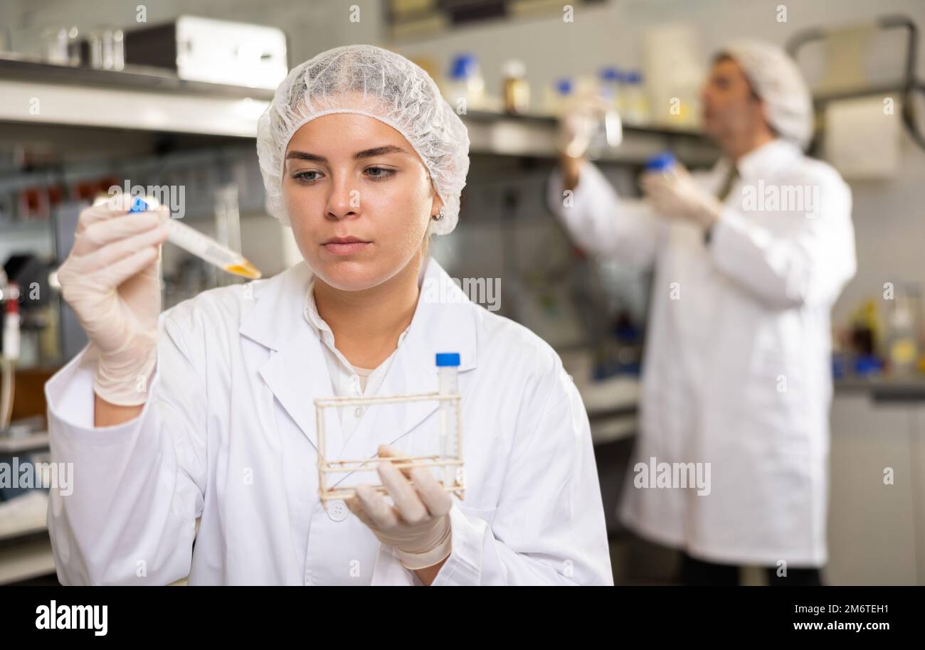 Shot of an young woman using equipment to work in a laboratory Stock ...