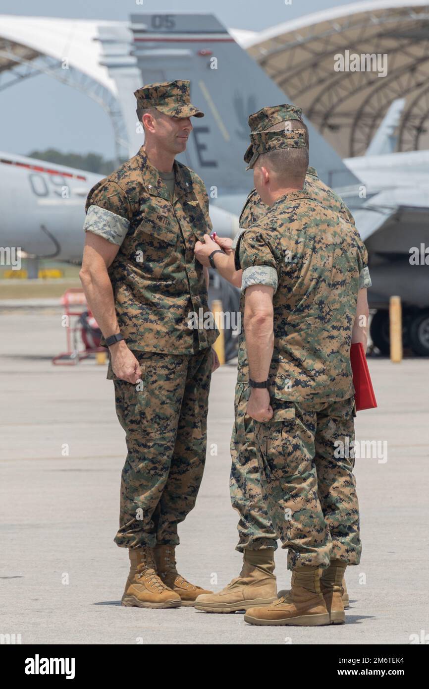 U.S. Marine Corps Lt. Col. Timothy M. Miller, left, outgoing commanding ...
