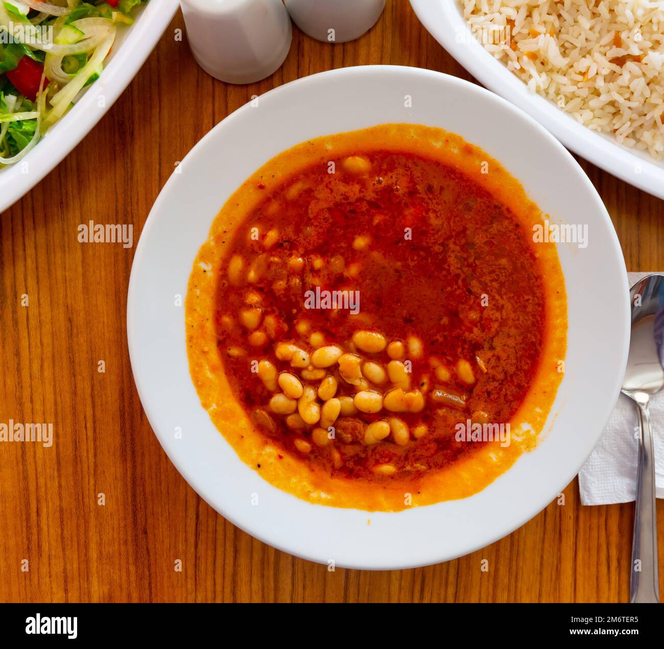 Turkish stew of white bean Kuru fasulye with salad and rice Stock Photo ...