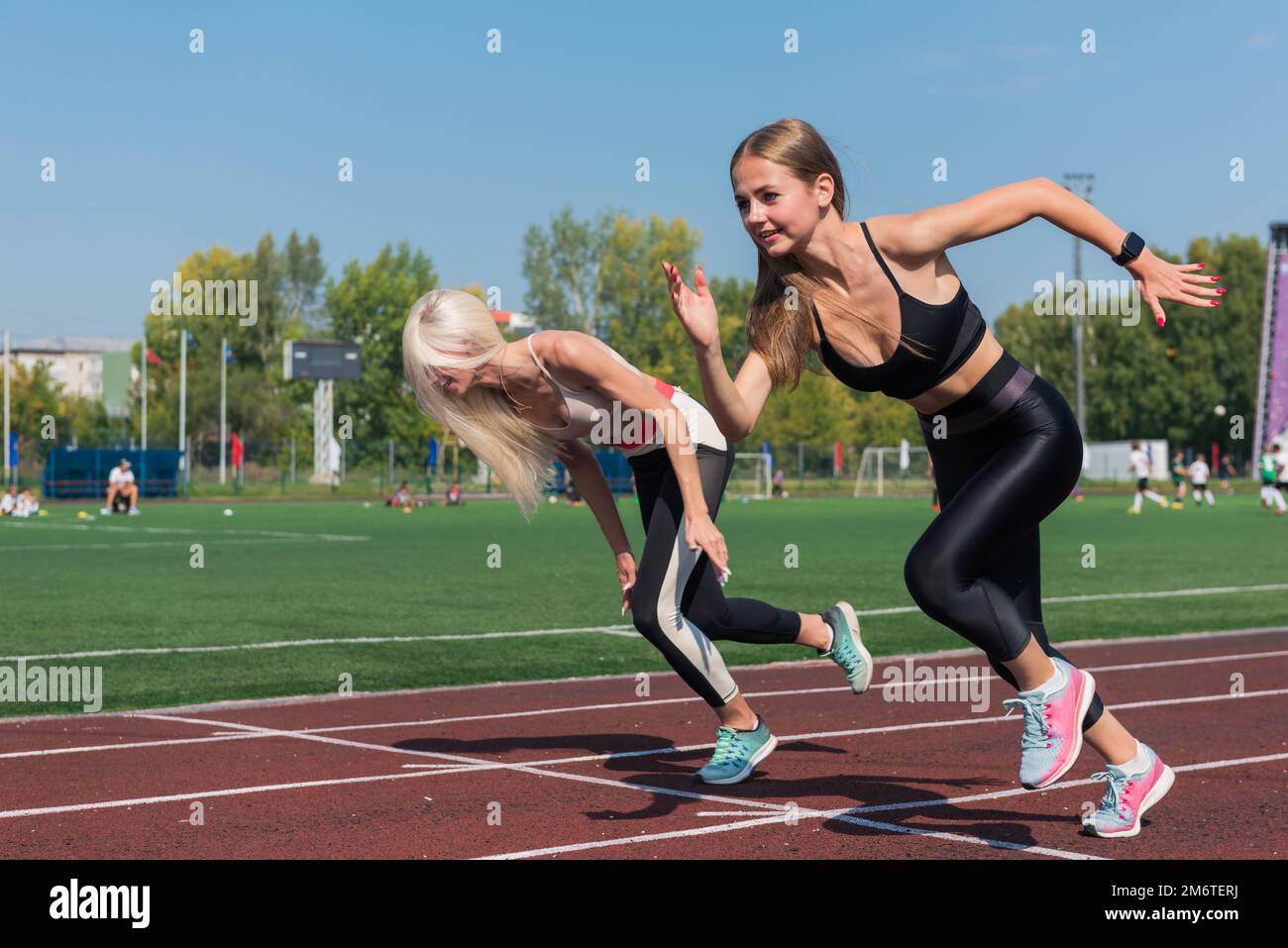 Two athlete woman runnner are training Stock Photo - Alamy