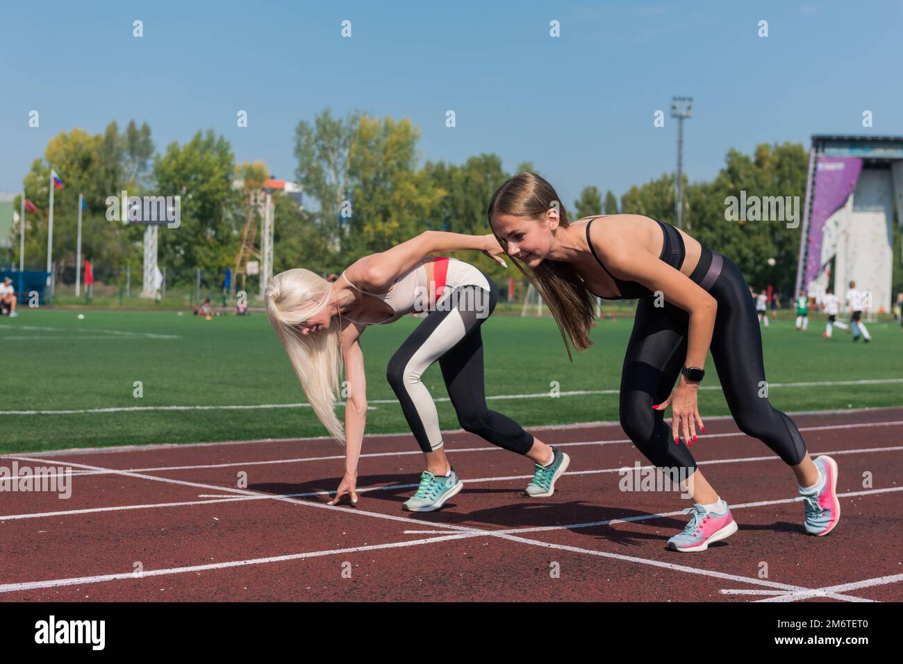 Two athlete woman runnner are training Stock Photo - Alamy