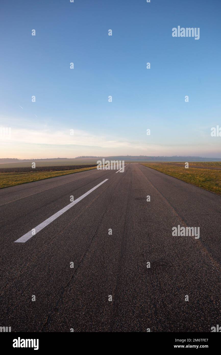 Small empty field airport with asphalt runway Stock Photo - Alamy