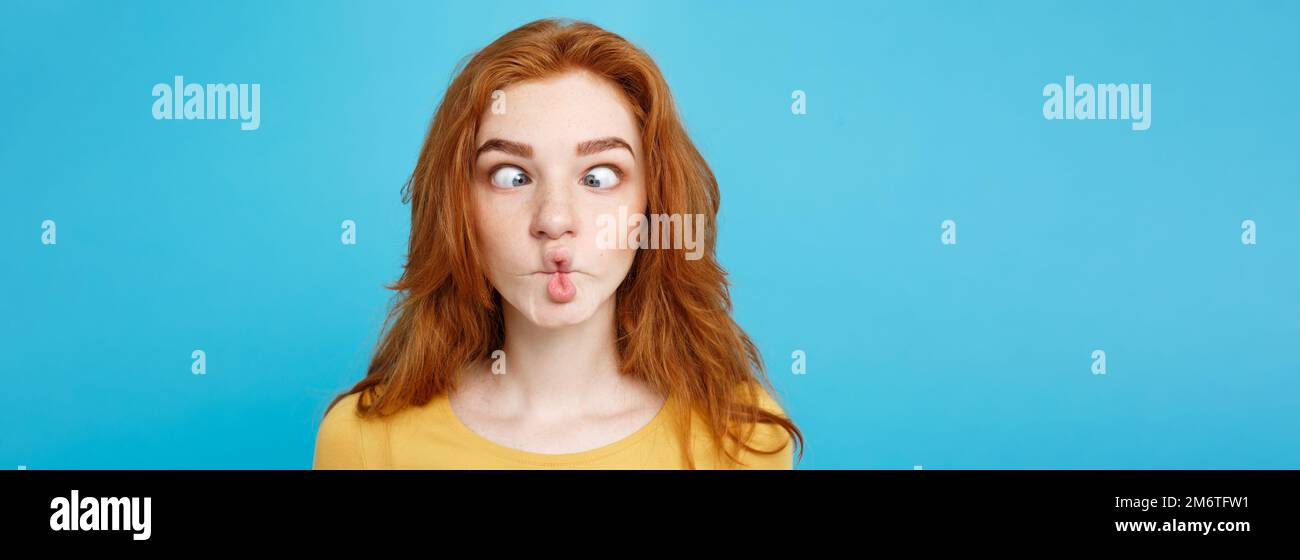 Headshot Portrait of happy ginger red hair girl with funny face looking ...