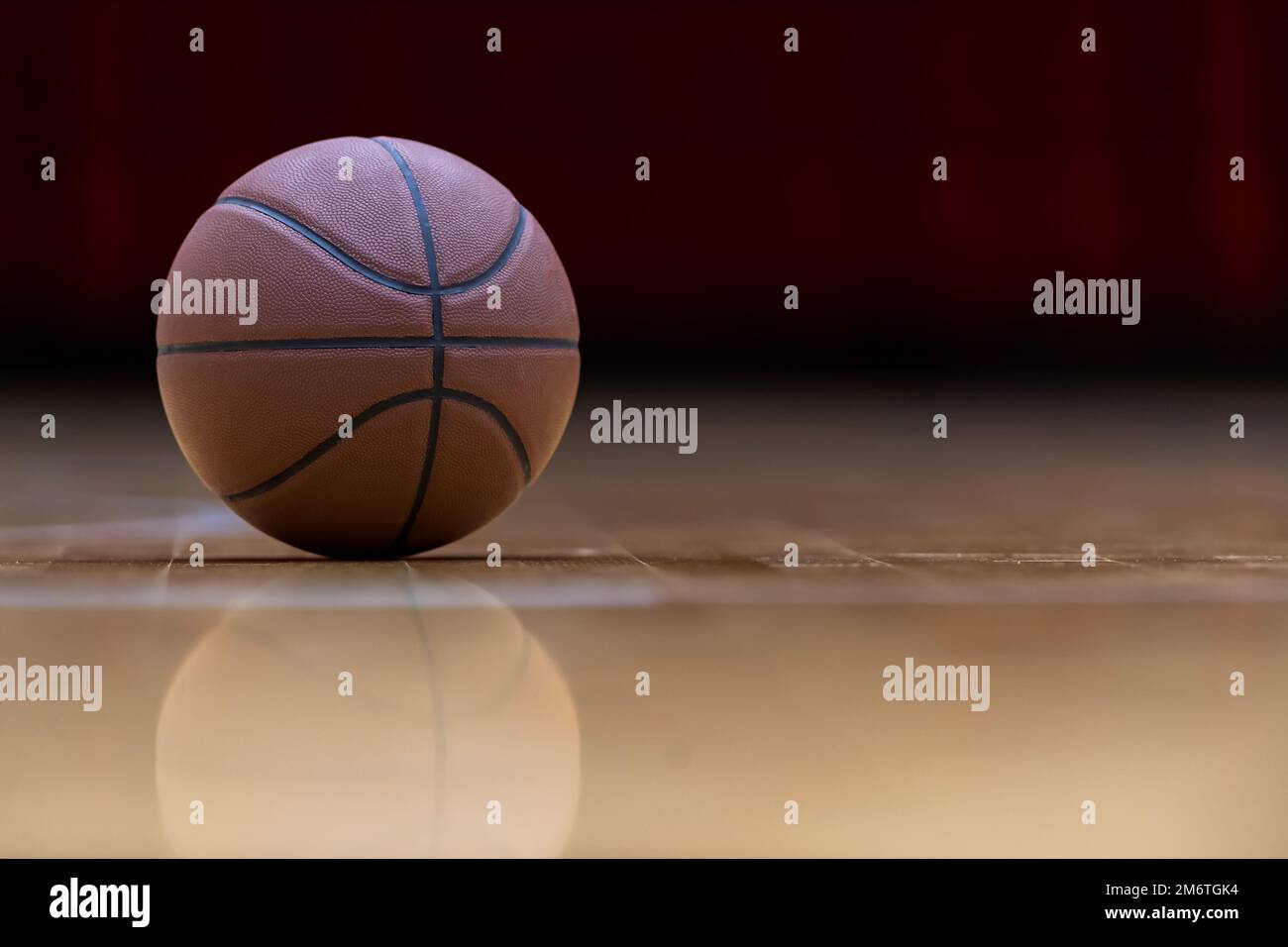 Basketball on hardwood court floor. Horizontal sport theme poster ...