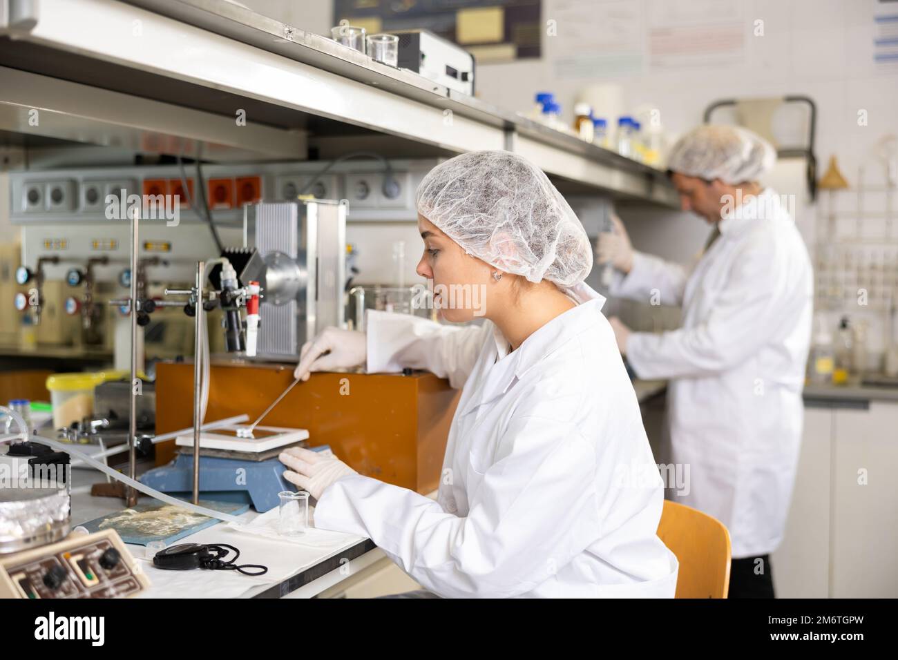 Focused female scientist working in research laboratory Stock Photo - Alamy