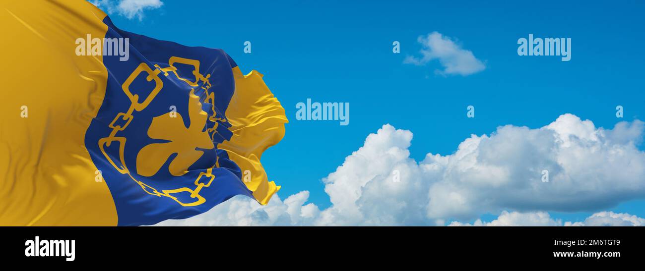 official flag of Hamilton Canada at cloudy sky background on sunset ...