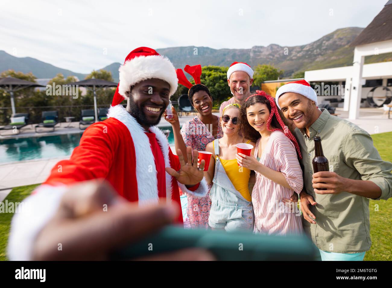 Diverse friends in santa hats hi-res stock photography and images - Alamy