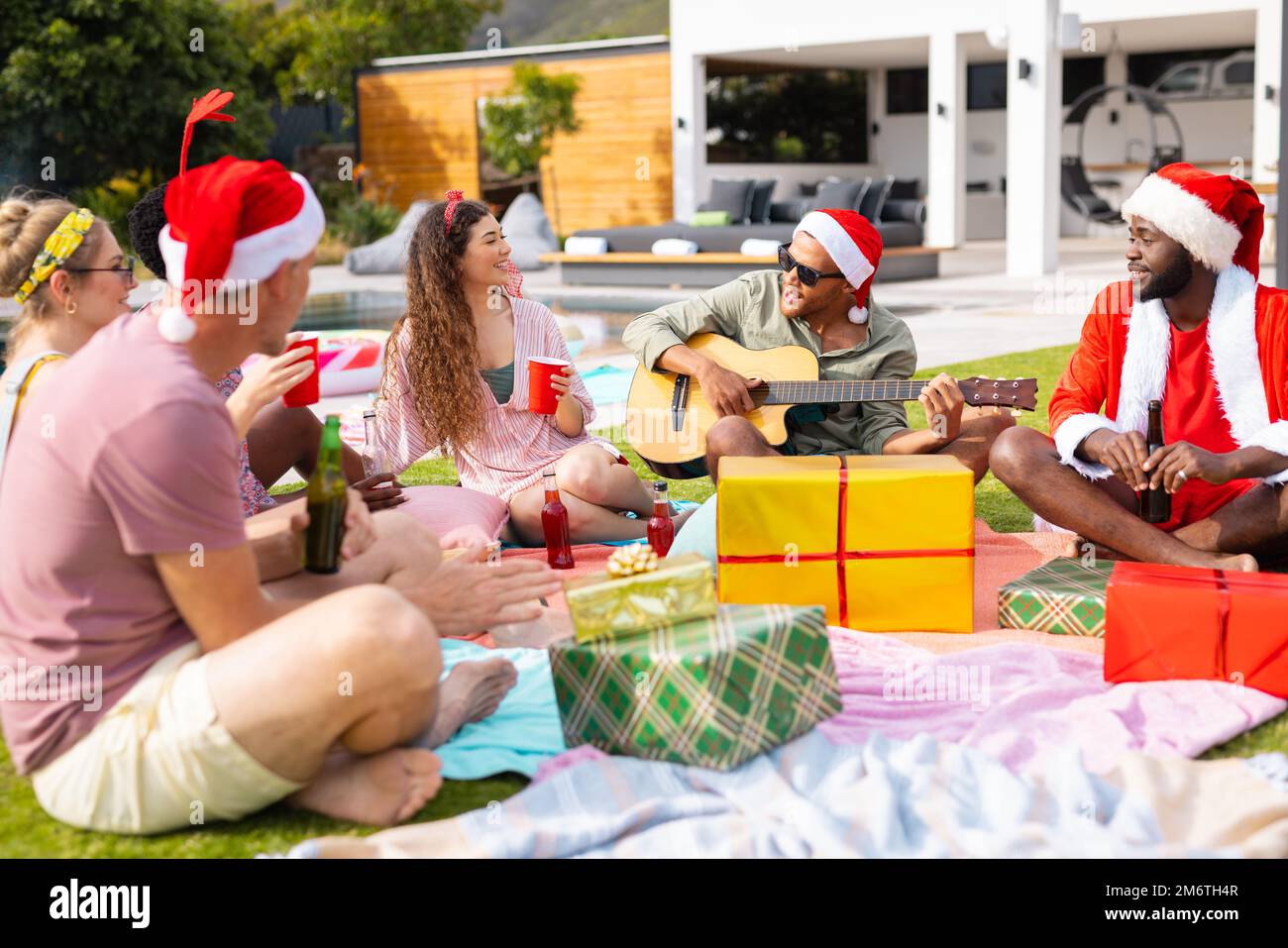 Diverse friends in santa hats hi-res stock photography and images - Alamy